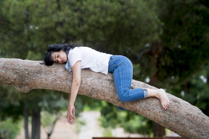Pretty Woman Sleeping in a Tree after Being Over Worked and Having ...