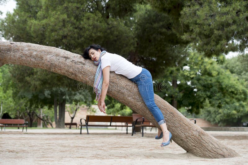 Pretty Woman Sleeping in a Tree after Being Over Worked and Having ...