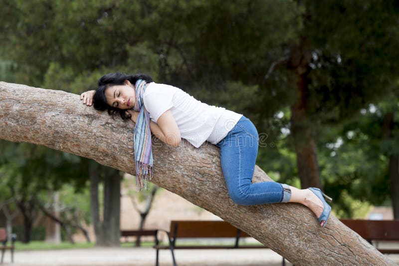 Pretty Woman Sleeping in a Tree after Being Over Worked and Having ...