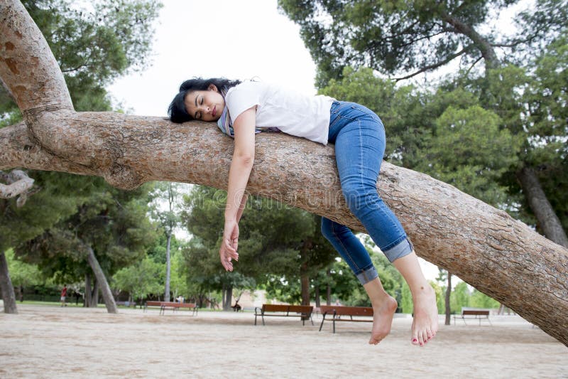 Pretty Woman Sleeping in a Tree after Being Over Worked and Having ...