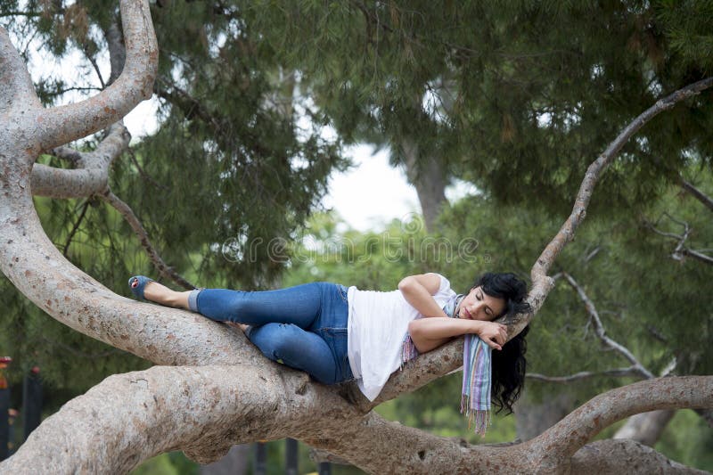 Pretty Woman Sleeping in a Tree after Being Over Worked and Having ...
