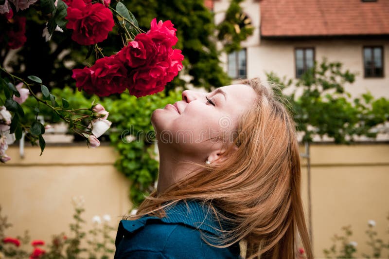 Pretty Young Woman Smelling Rose Stock Photo - Image of person, pretty ...