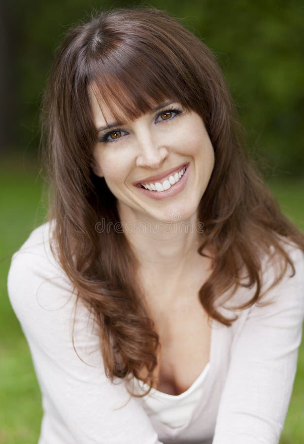 Pretty woman smiling stock photo. Image of park, field - 36926738