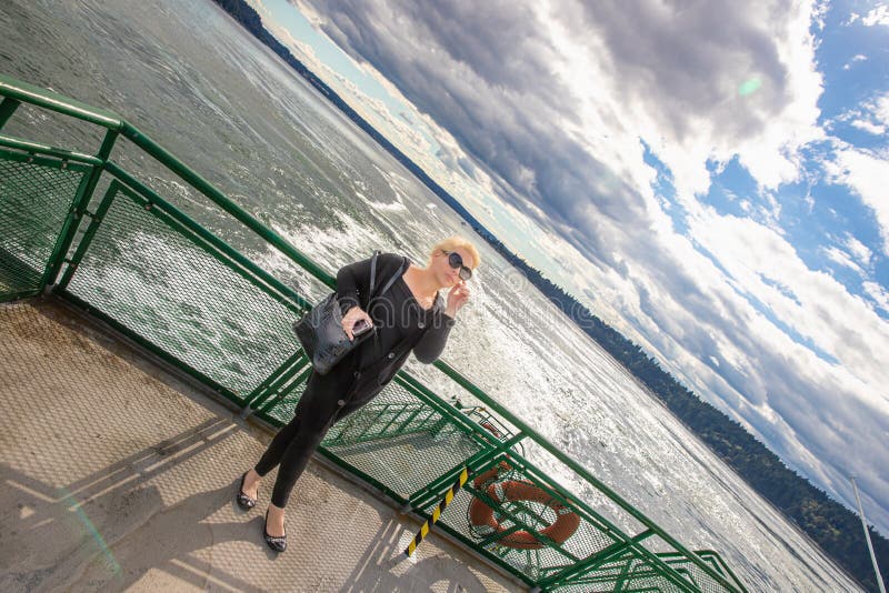 Blond woman on boat deck stock image. Image of beautiful - 260661001