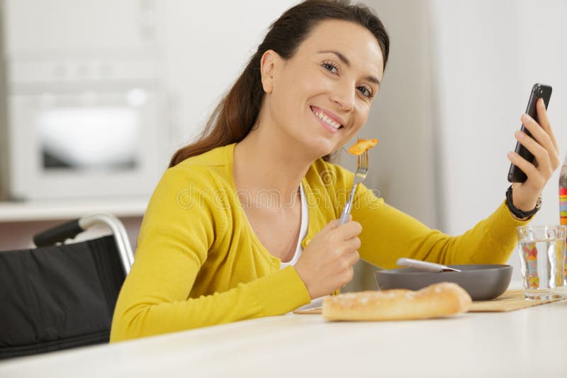 Pretty Woman Talking on Phone while Having Lunch Stock Photo - Image of ...