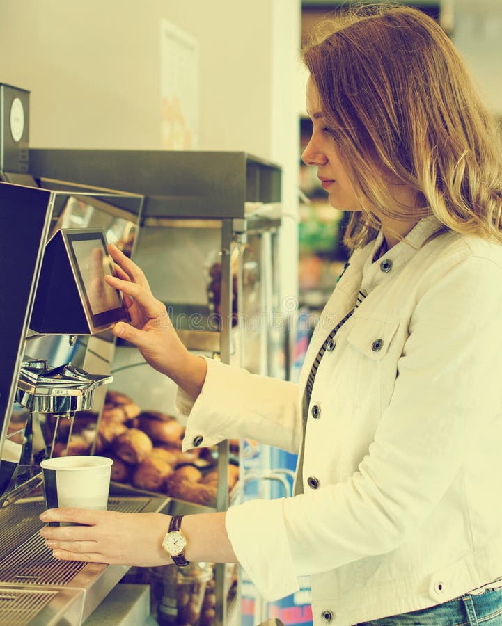 Pretty Woman Using Coffee Vending Machine. Stock Image - Image of ...