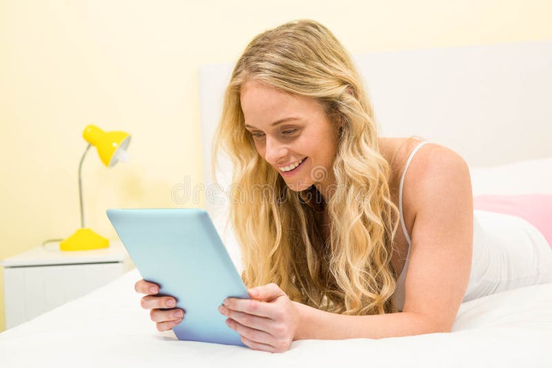 Pretty woman using tablet stock image. Image of household - 67722925