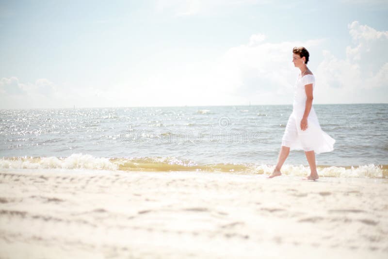 Pretty Woman Walking the Beach Stock Photo - Image of beauty, adult ...
