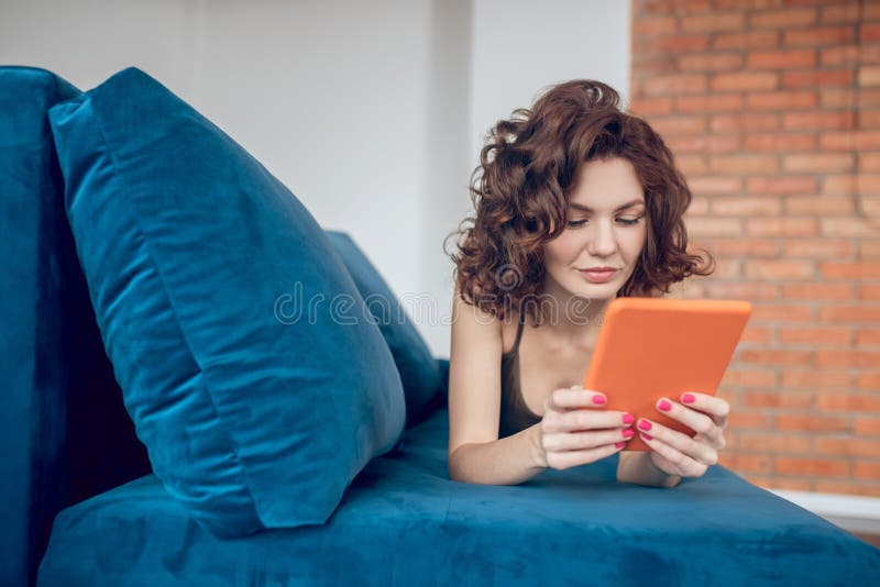 Pretty Woman Watching Something Online and Looking Interested Stock ...