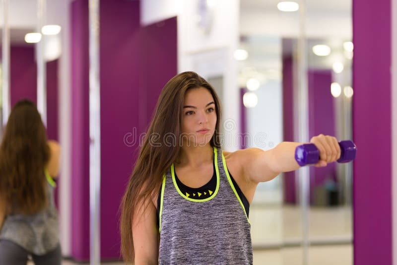 Pretty woman working out stock image. Image of reflection - 79249069