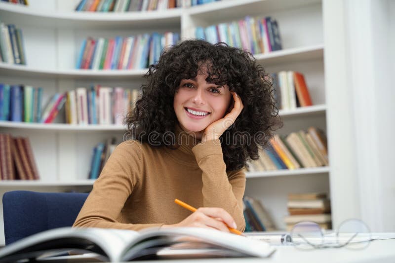 Pretty Woman Working on the Project in the Library Stock Image - Image of involved, smiling ...