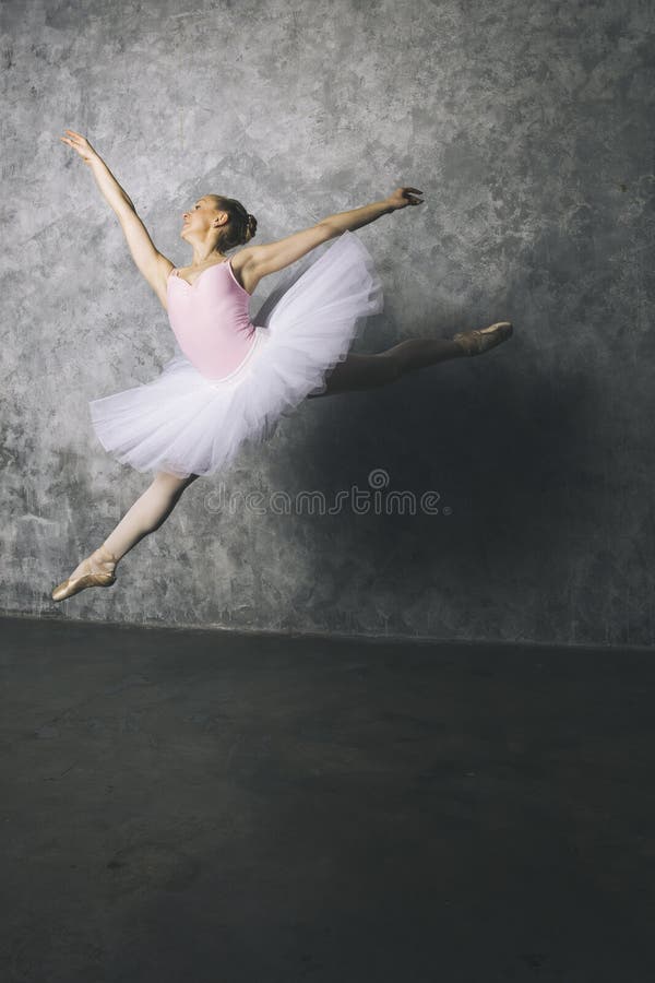 Pretty Young Ballerina Dancer Dancing Classical Ballet Against Rustic ...