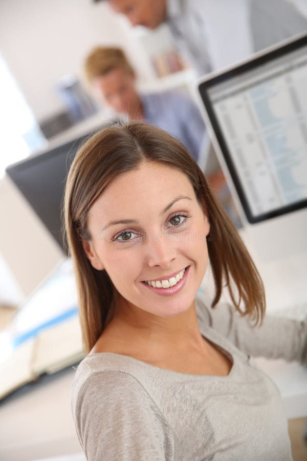 Pretty Young Brunette Woman in Office Stock Image - Image of ...