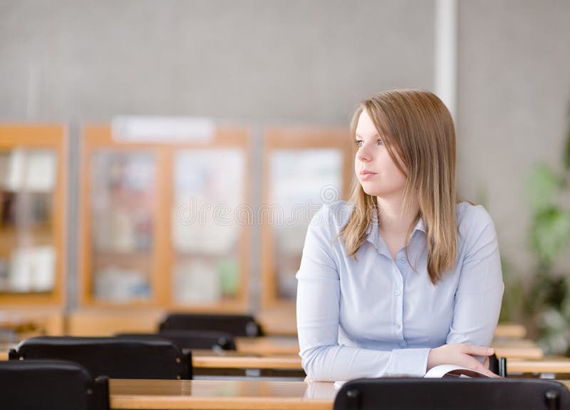 Pretty Young College Student in a Library. Looking Away Stock Image ...