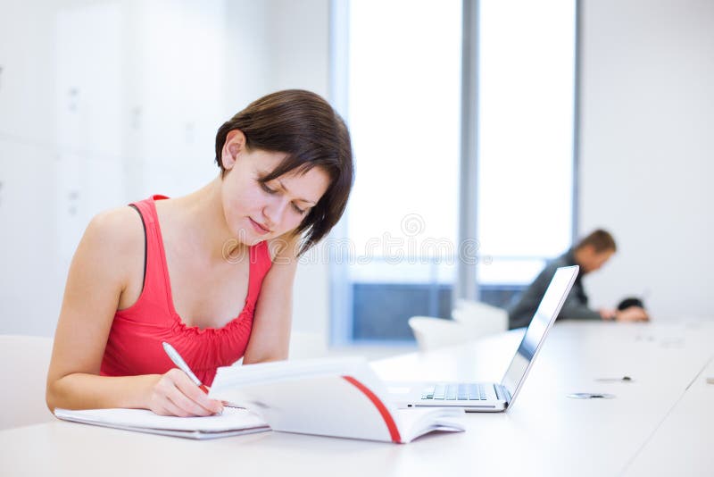 Pretty Young College Student Studying in the Library Stock Photo ...