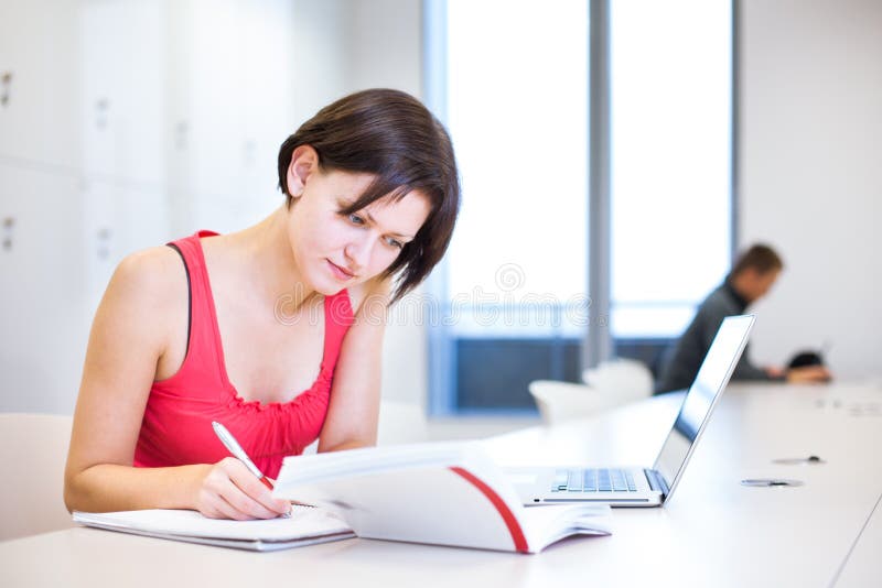 Pretty, Young College Student Studying in the Library Stock Photo ...