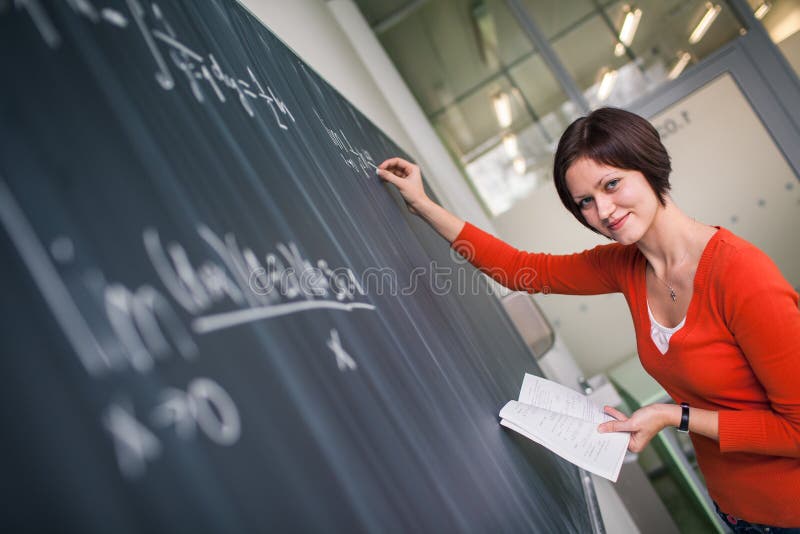 Pretty, Young College Student Writing on the Chalkboard Stock Photo ...