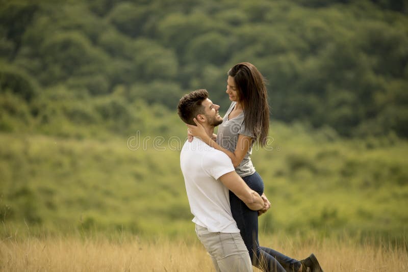Pretty Young Couple in Love Outside in Spring Nature Stock Photo ...