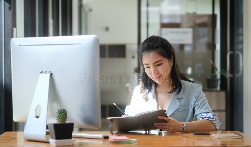 Pretty Young Female Office Worker Sitting on Bright Modern Office and ...
