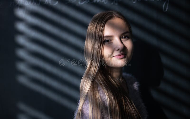 Pretty, Young Female Student in Front of a Blackboard Stock Image ...