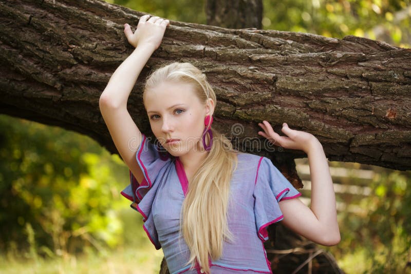 Pretty Young Girl Near a Tree Stock Image - Image of green, cheerful ...