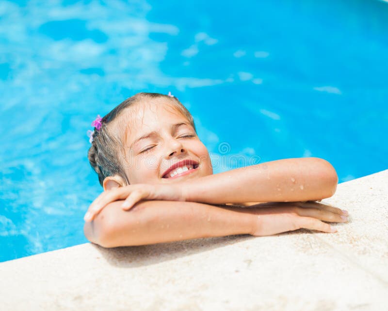Pretty young girl at pool stock image. Image of leisure - 24466807