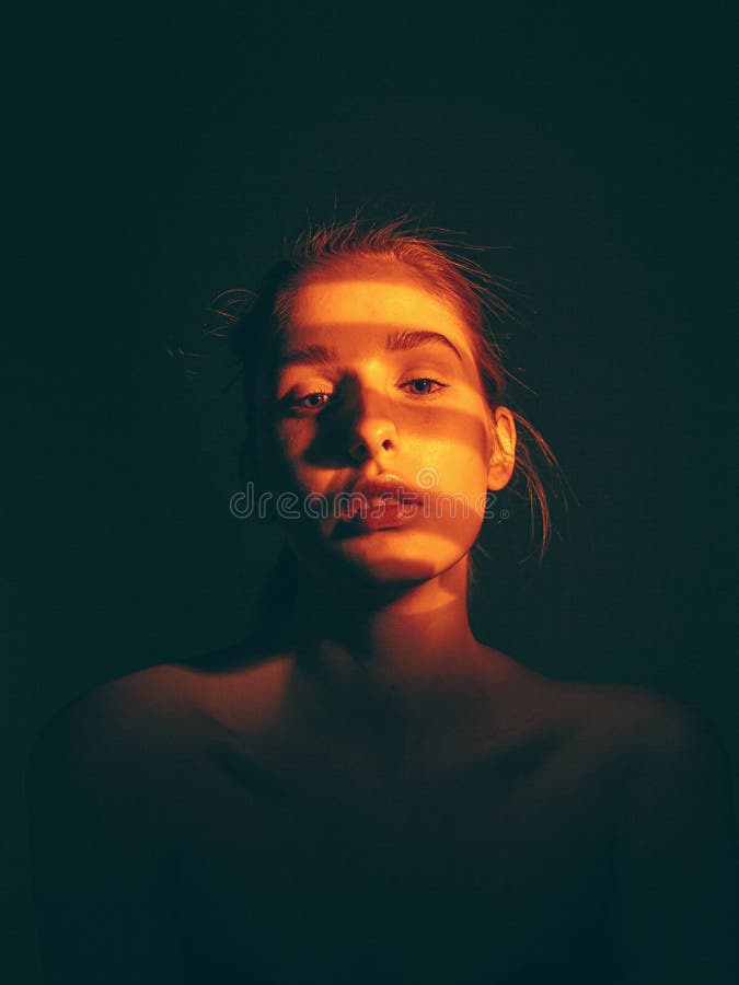 Pretty Young Girl with Shadow Pattern on Face in Studio on Black ...