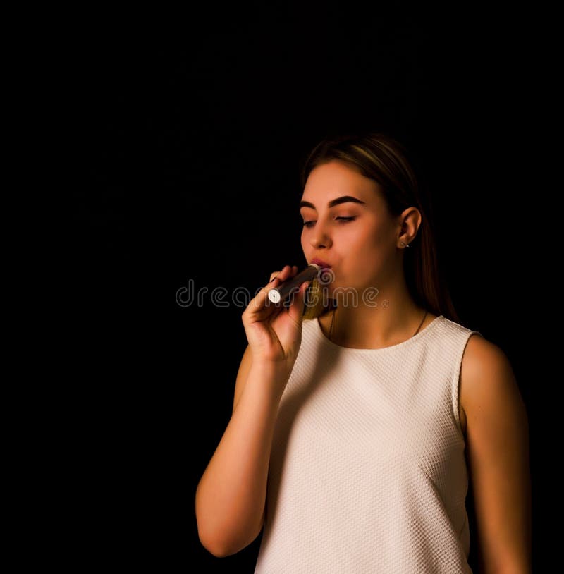 Pretty Young Girl Uses Electronic Cigarette Stock Image - Image of girl ...