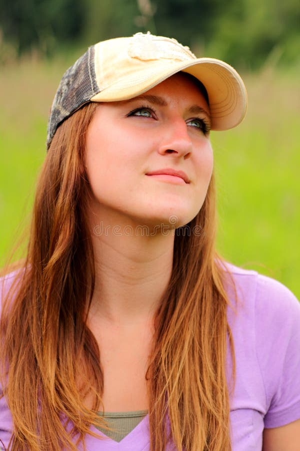 Pretty Young Lady Wearing Hat Stock Image - Image of purple, work: 20074455