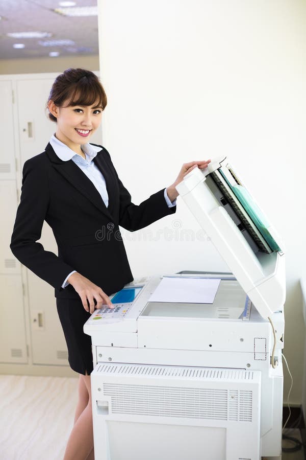 Pretty Young Secretary Using Photocopy Machine Stock Image - Image of ...