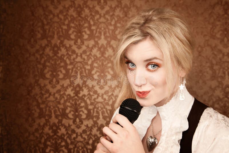 Pretty Young Singer or Comedian with Microphone Stock Photo - Image of ...