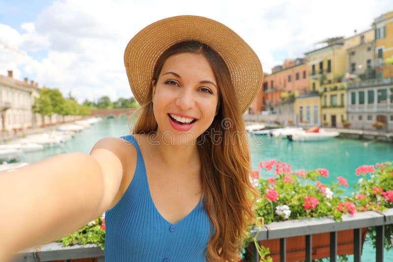 Pretty Young Tourist Woman Takes Self Portrait On Lake Garda Italy
