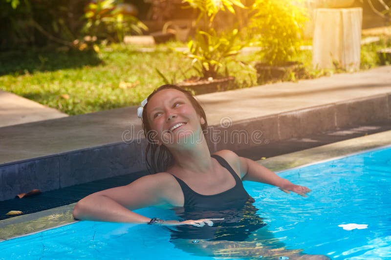 Pretty Young Woman In Black Swimsuit Relaxing In Swimming Pool Stock