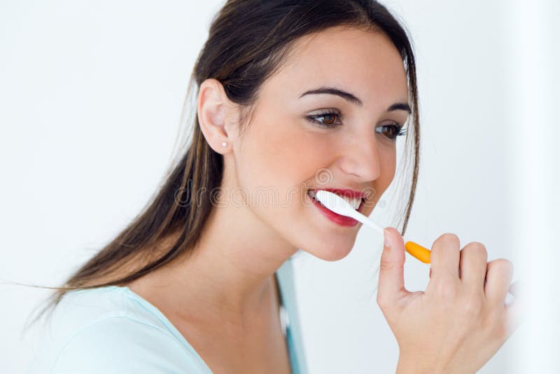Pretty Young Woman Brushing Her Teeth. Stock Photo - Image of health ...