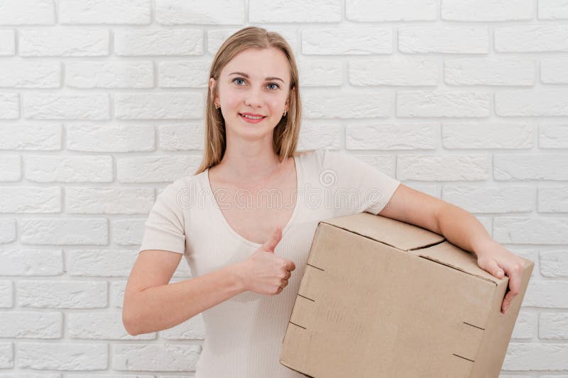Pretty Young Woman with Cardboard Box. Delivering a Parcel Stock Photo ...