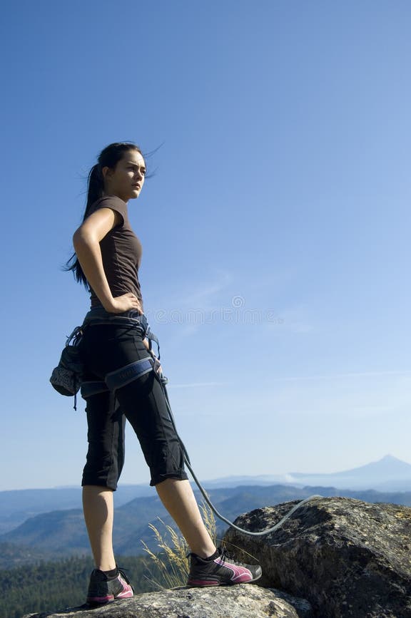 Pretty Young Woman on Cliff Stock Image - Image of park, extreme: 21935443