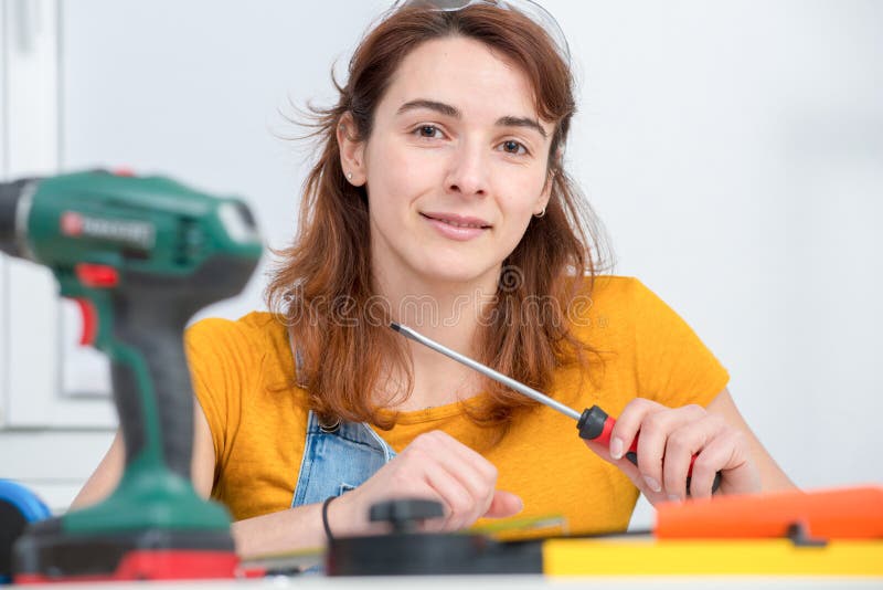 Pretty Young Woman Doing DIY Work at Home Stock Image - Image of worker ...