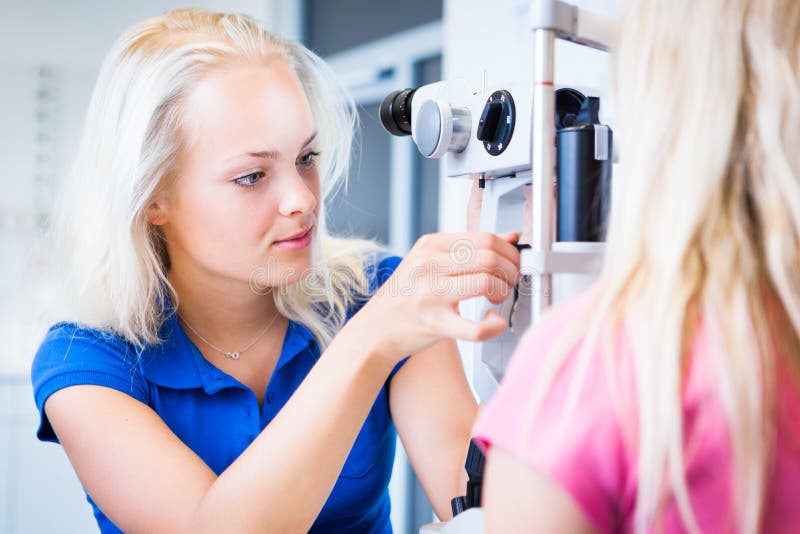 Pretty Young Woman Having Her Eyes Examined Stock Photo - Image of ...