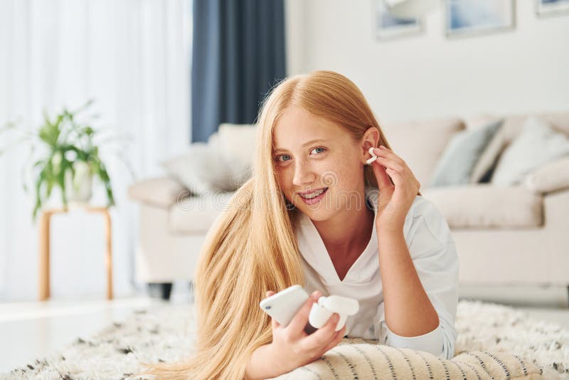 Pretty Young Woman is at Home at Daytime Stock Photo - Image of ...