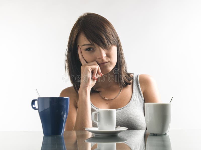 Pretty, Young Woman Looking Coffee Mugs on Bright Background Stock ...