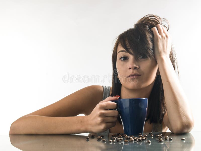 Pretty, Young Woman Looking Coffee Mugs on Bright Background Stock ...