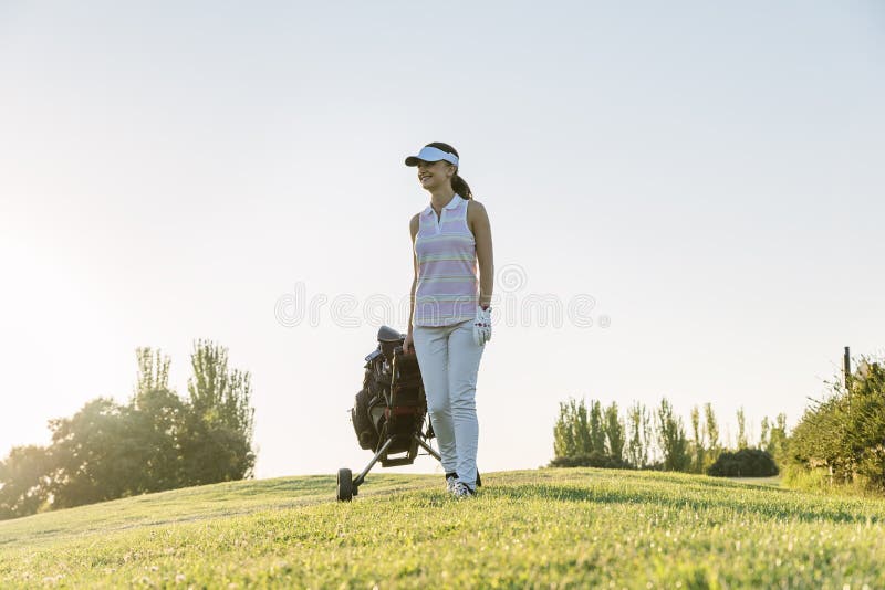Pretty Young Woman Playing Golf. Stock Photo - Image of view, golfing ...