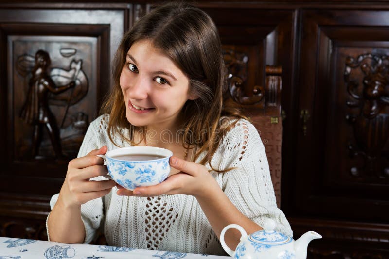 Pretty Young Woman Sitting with a Cup of Tea Stock Image - Image of ...