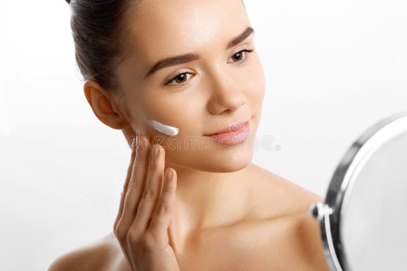 Pretty and Young Woman Smiling and Holding the Mirror. Stock Photo ... Pretty and Young Woman Smiling and Holding the Mirror. Stock Photo ...