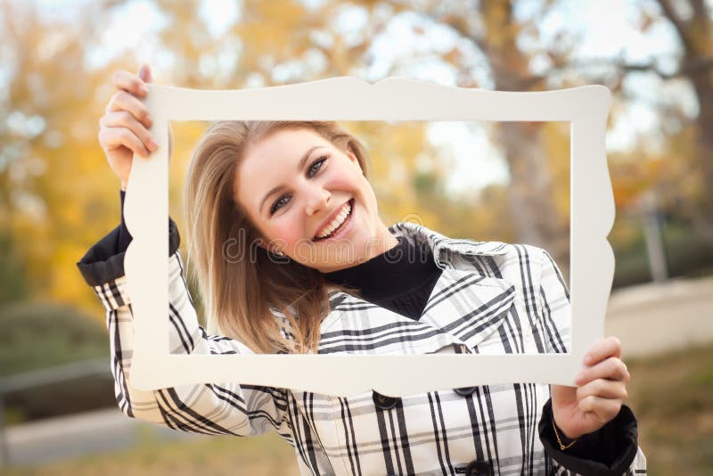 Pretty Young Woman Smiling In The Park With Picture Frame Stock Image ...