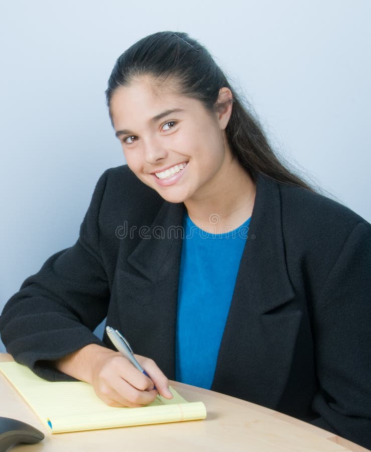 Pretty Young Woman at Table with Pen and Paper Stock Photo - Image of ...