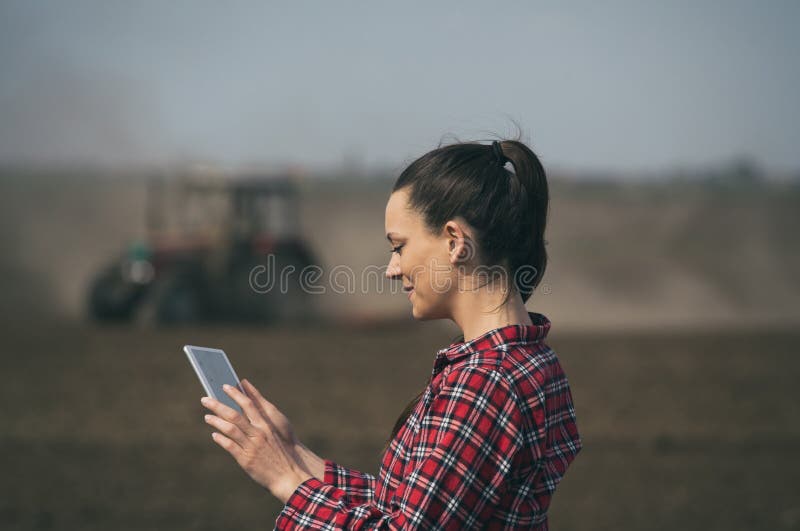 Farmer Woman with Tablet and Tractor in Field Stock Photo - Image of ...