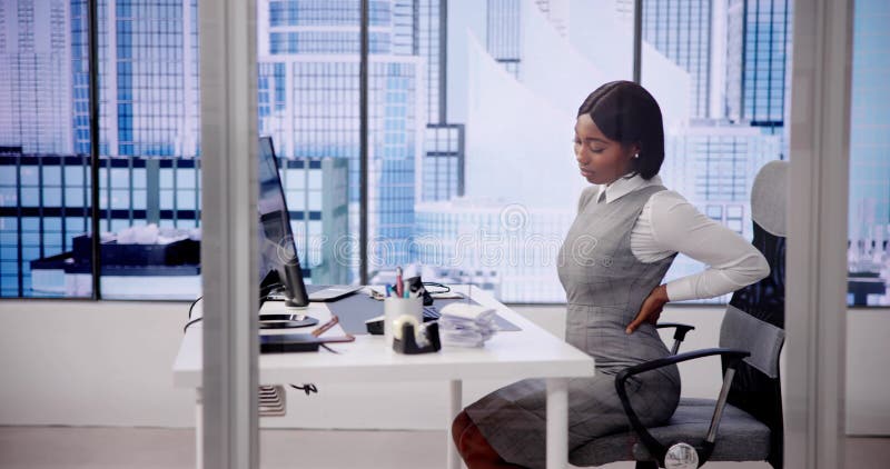 Preventing Bad Back Posture: Woman Overcoming Office Computer Stock ...