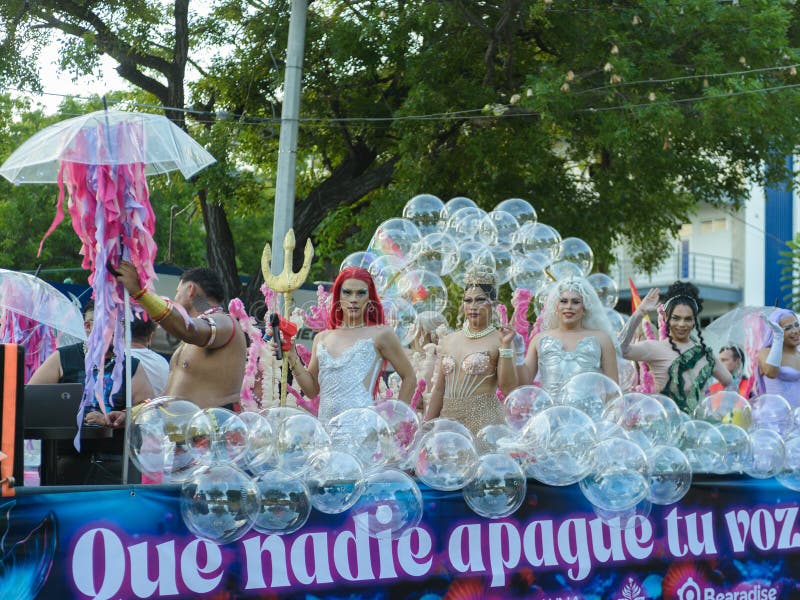 A Pride Parade Float, Adorned with Large Bubbles and Costumed ...