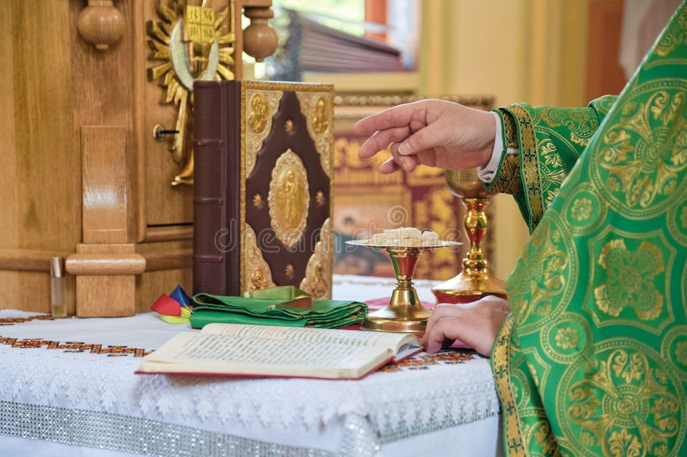 Priest Consecrates Bread during Liturgy Ceremony. Eastern Catholic ...